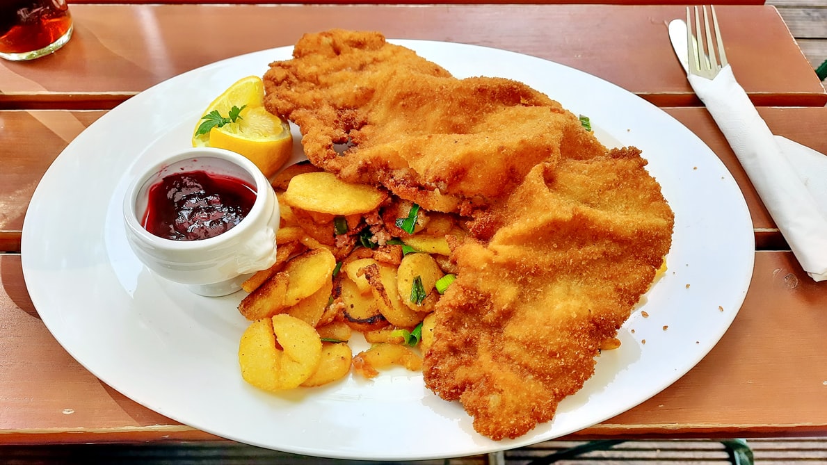 Schnitzels: waar komen ze vandaan en waar eet je de lekkerste?